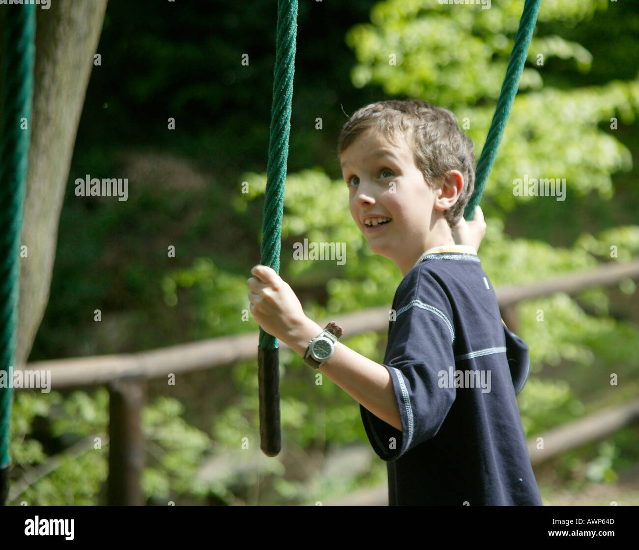 Boy holding ropes Stock Photo - Alamy