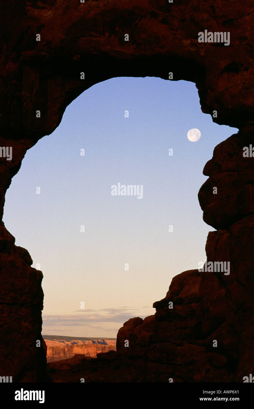 Moon seen through turret Arch in Arches National Park Utah home of over ...