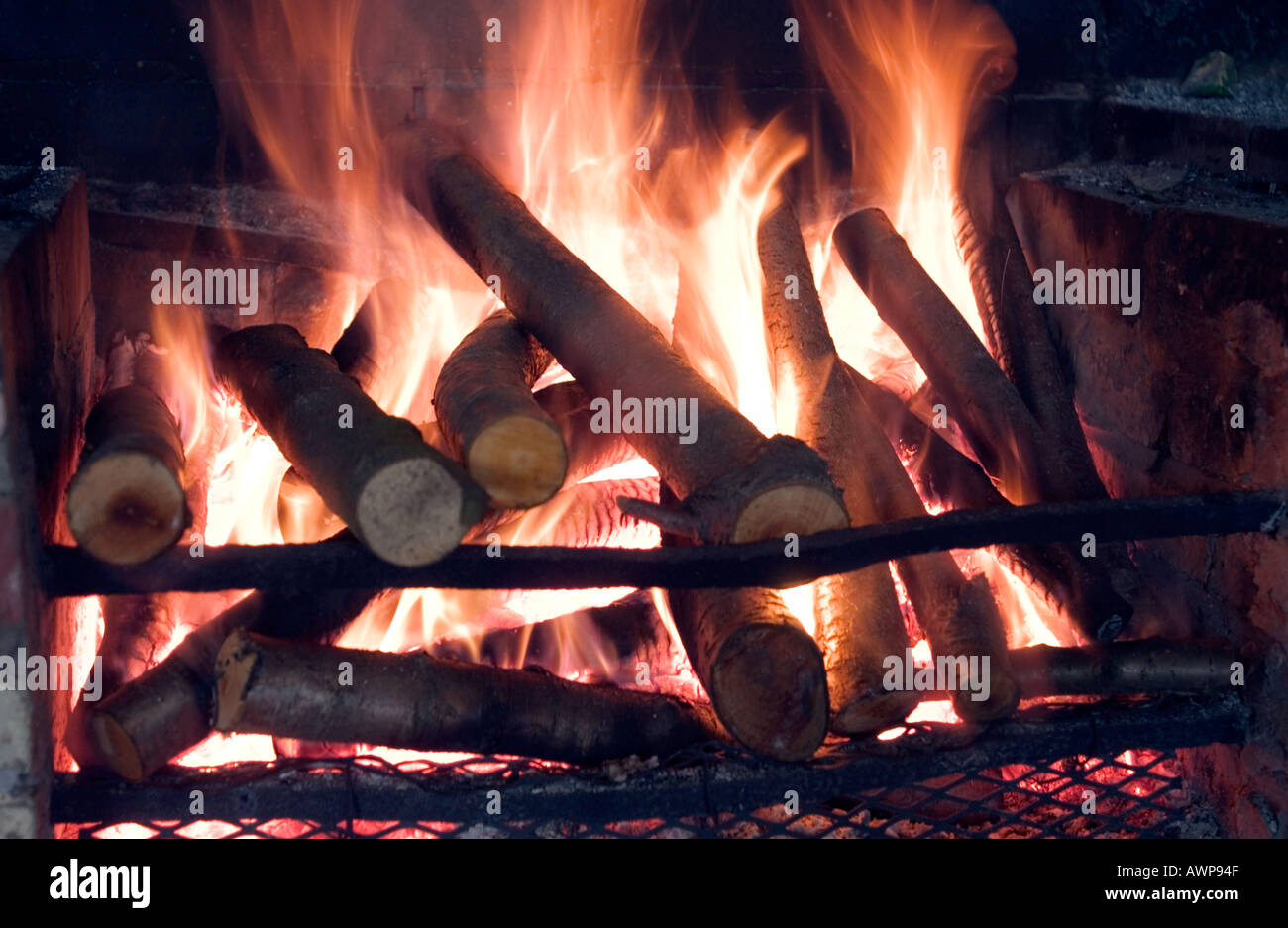 Log fire burning and blazing an old farm workshop Stock Photo - Alamy