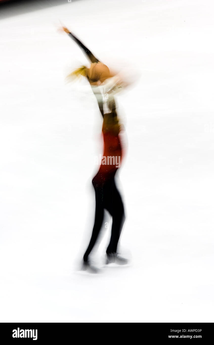 Blurred action of pairs figure skaters Stock Photo - Alamy