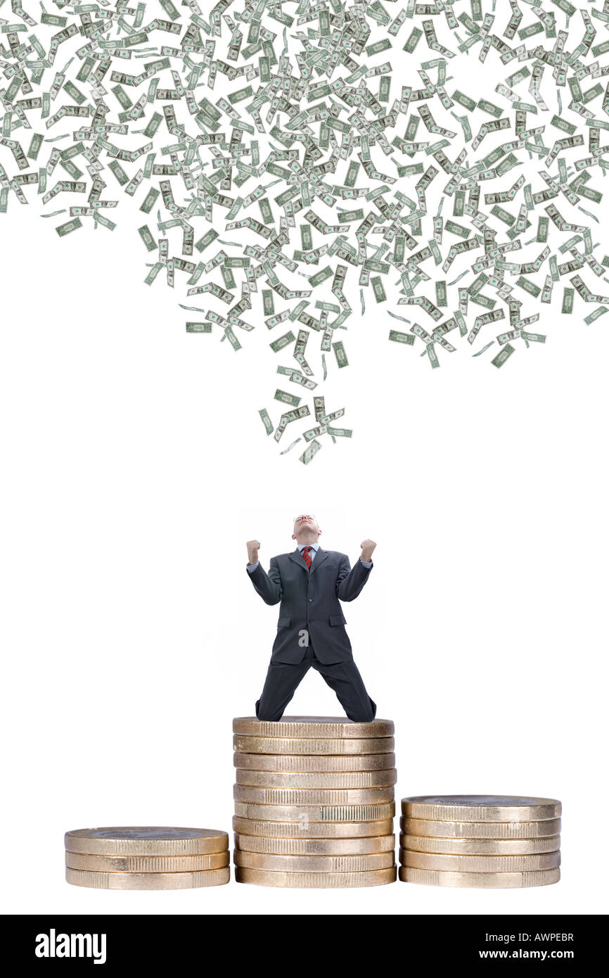 Young businessman with falling dollars. Full isolated studio picture ...