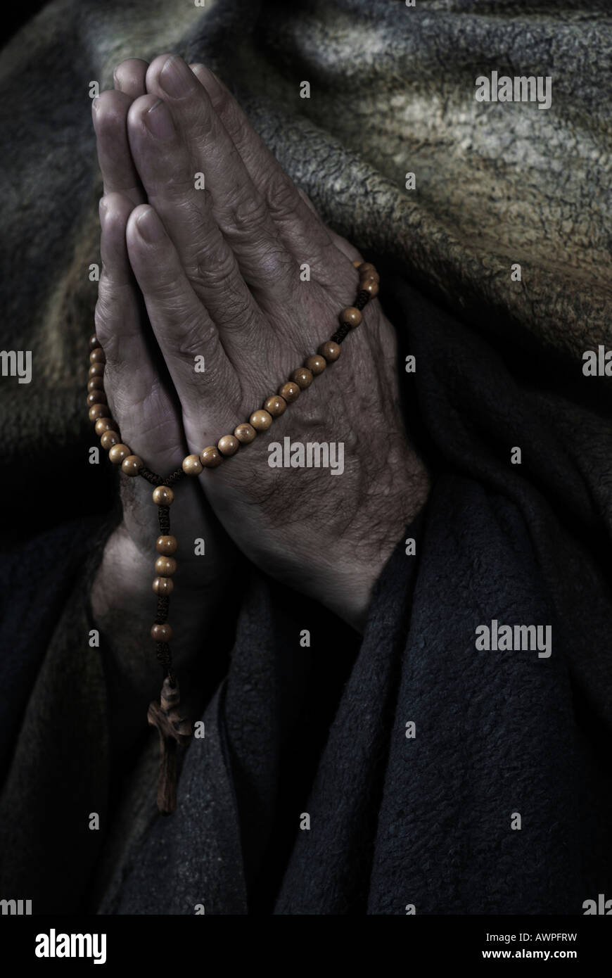 Hooded monk wearing habit, praying Stock Photo - Alamy