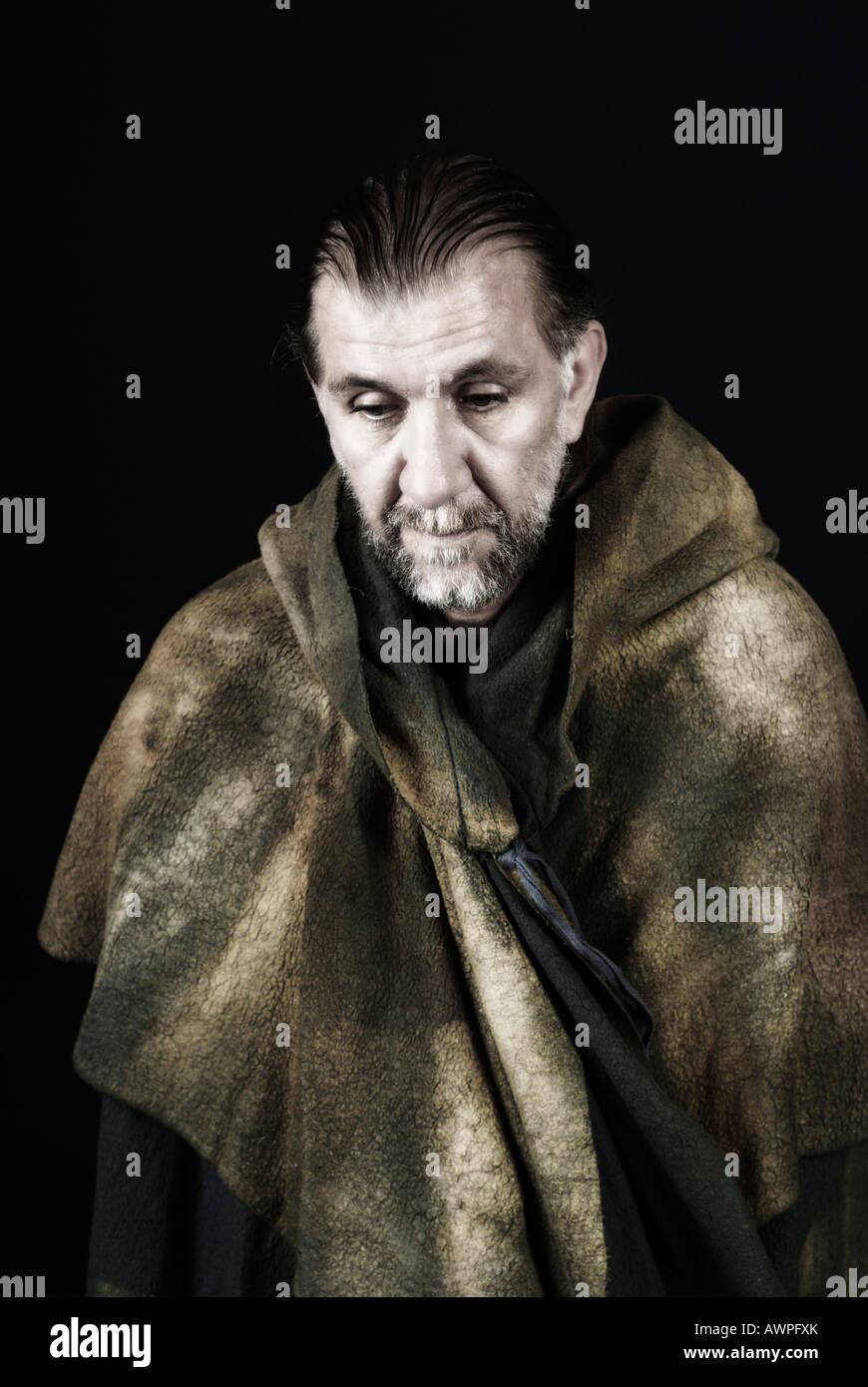 Monk wearing cloak Stock Photo - Alamy