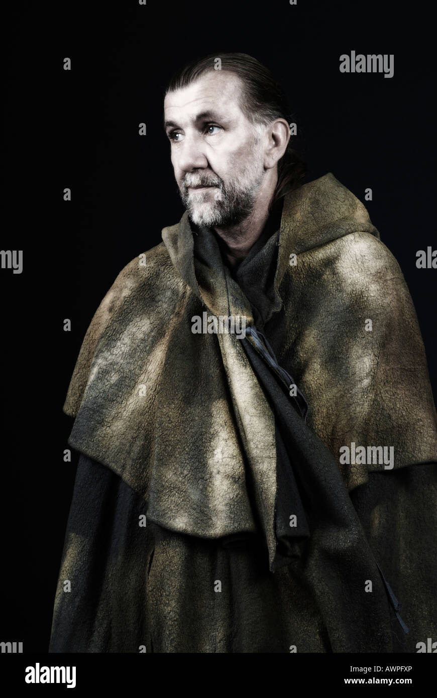 Monk wearing cloak Stock Photo - Alamy