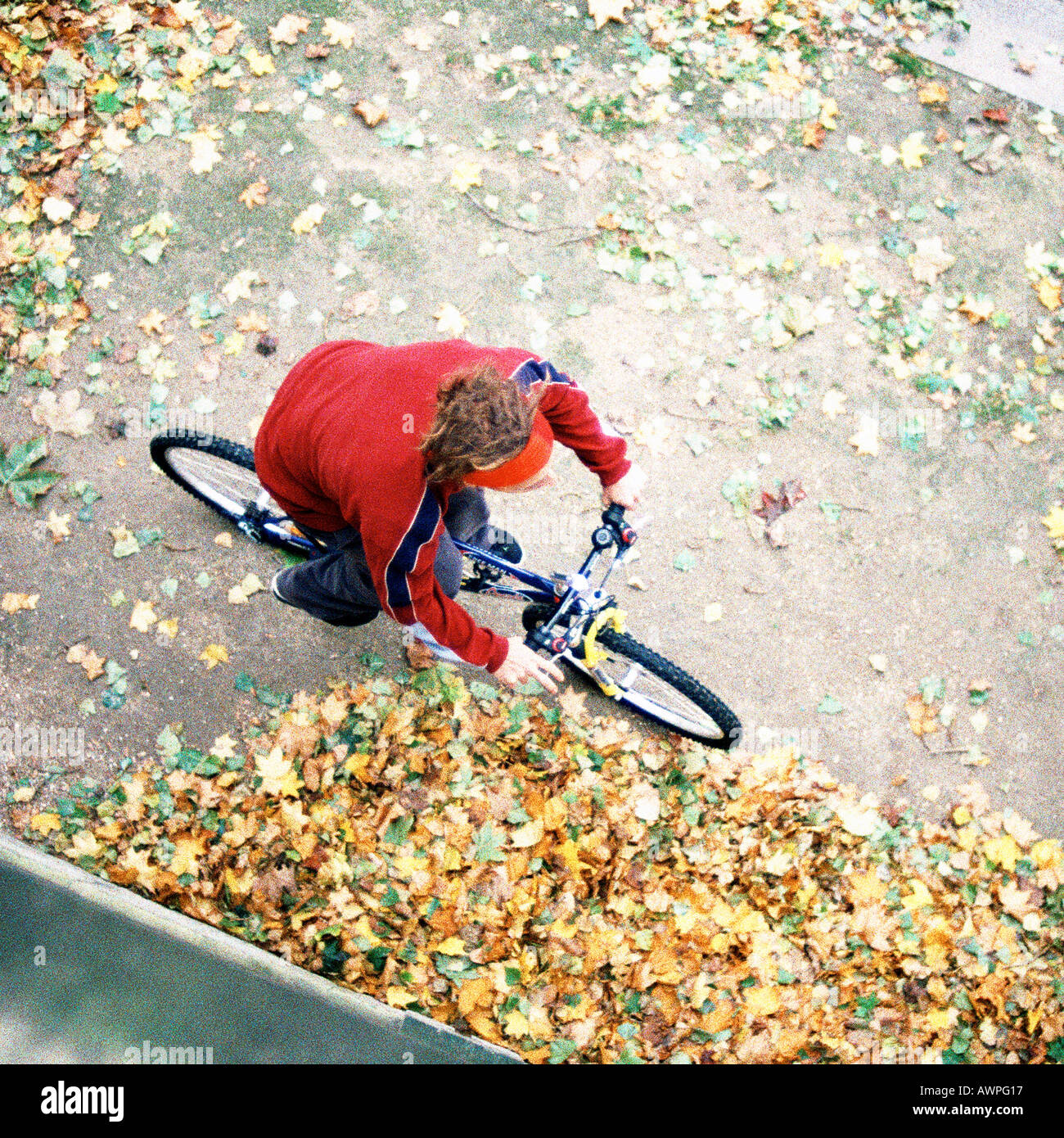 Person riding bike, elevated view Stock Photo - Alamy