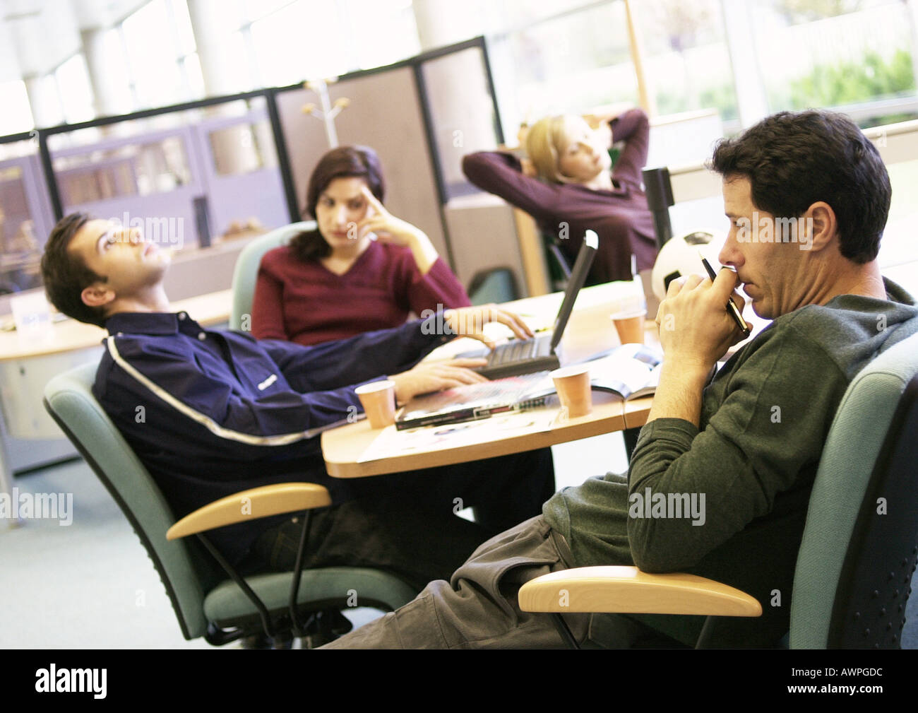 People sitting in office Stock Photo - Alamy
