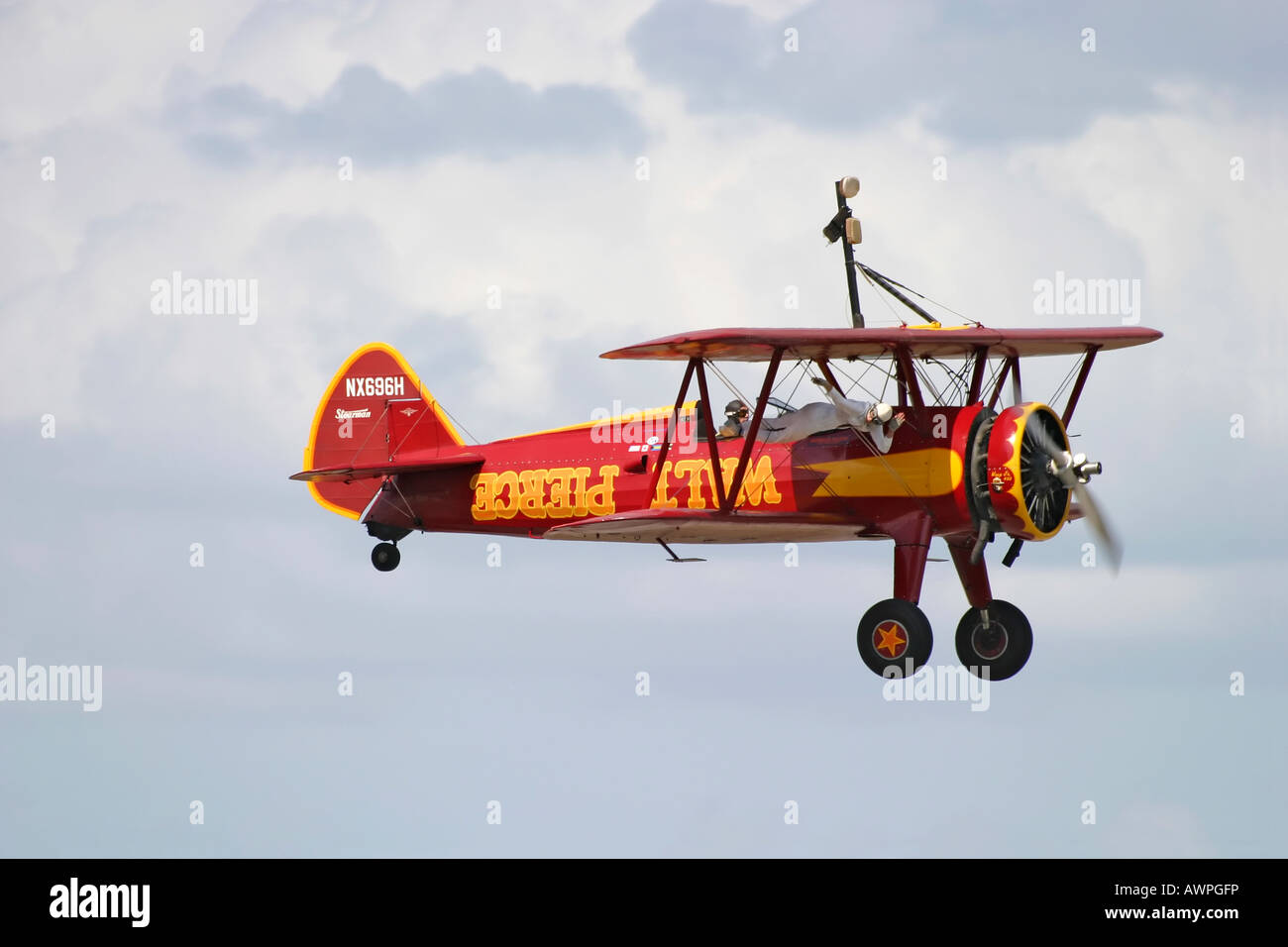 A Boeing PT17 Stearman biplane displaying with a wing walker between ...