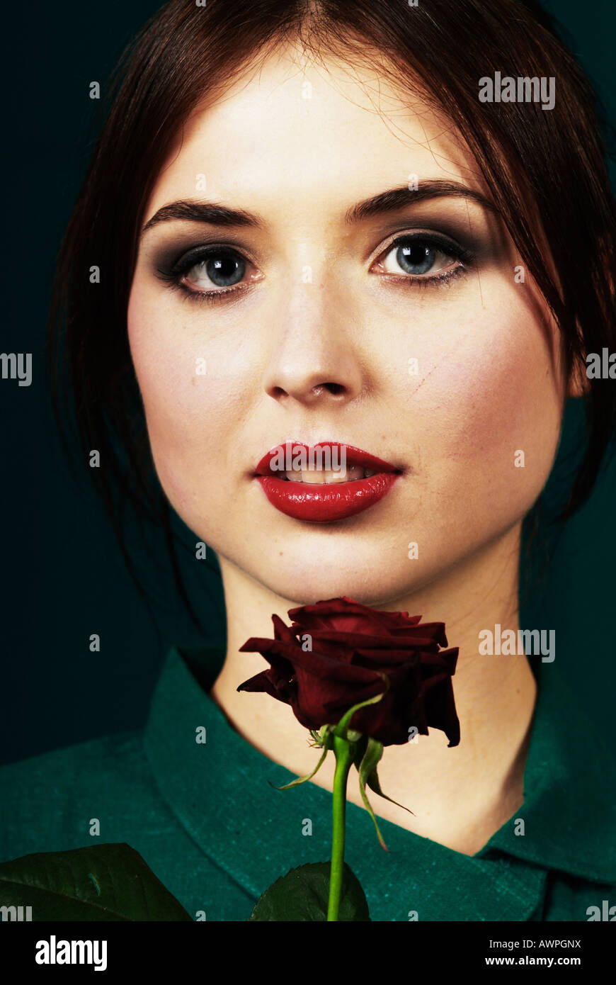 Young woman with red rose Stock Photo - Alamy