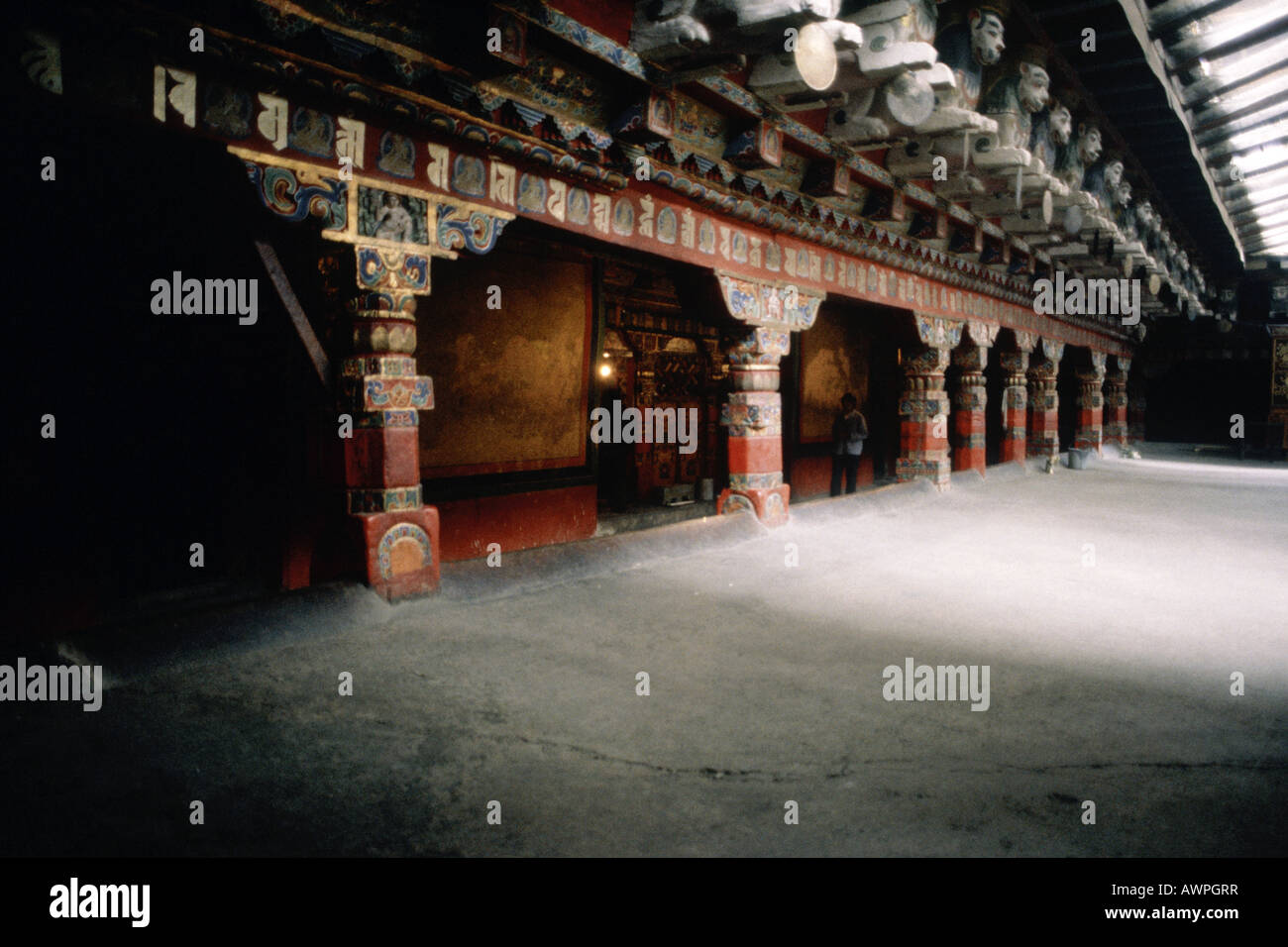 Jokhang Temple. Interior. Dark, full of shrines, drapes, painted walls ...