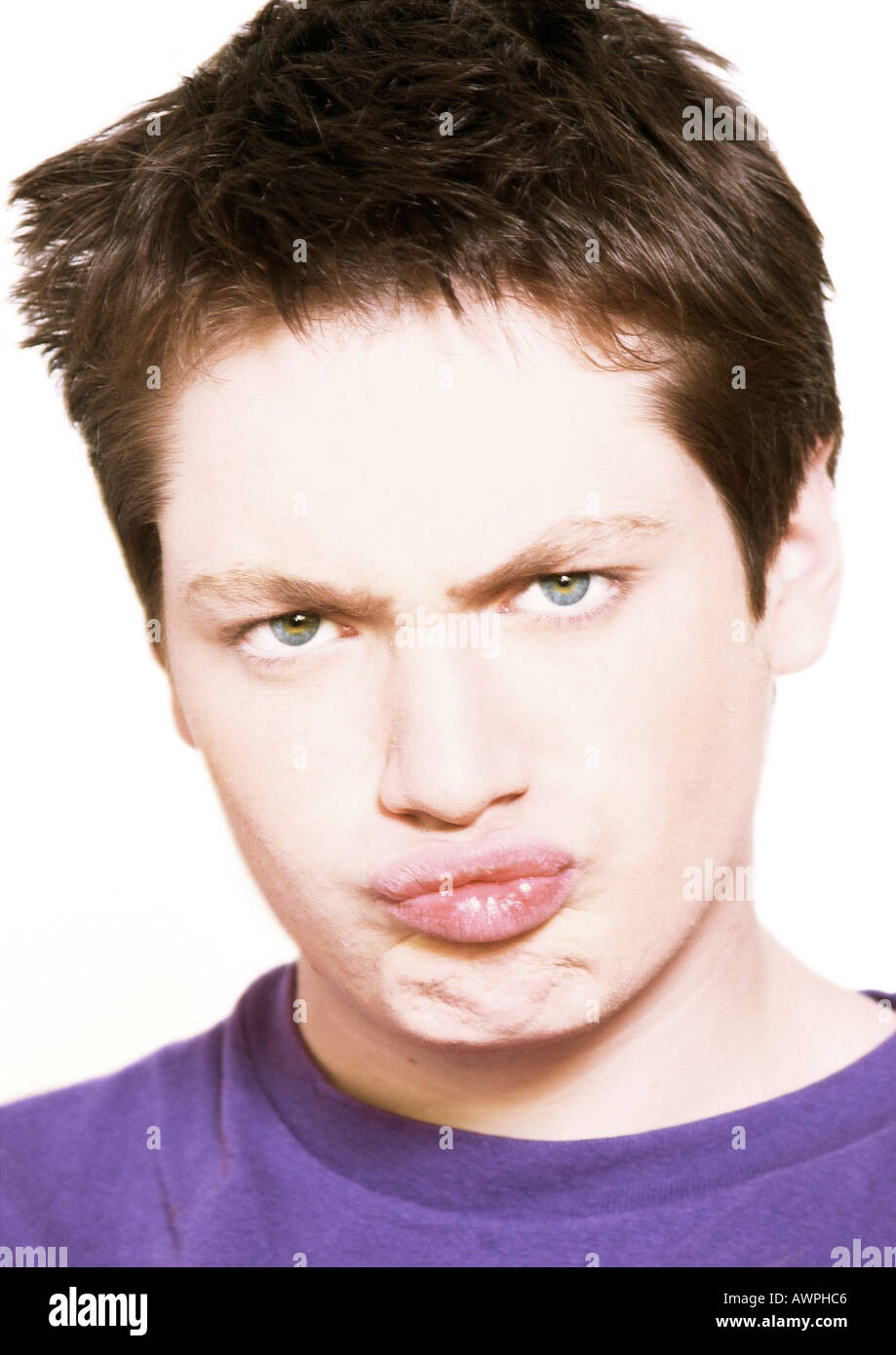 Teenage boy making face, close-up, portrait Stock Photo - Alamy