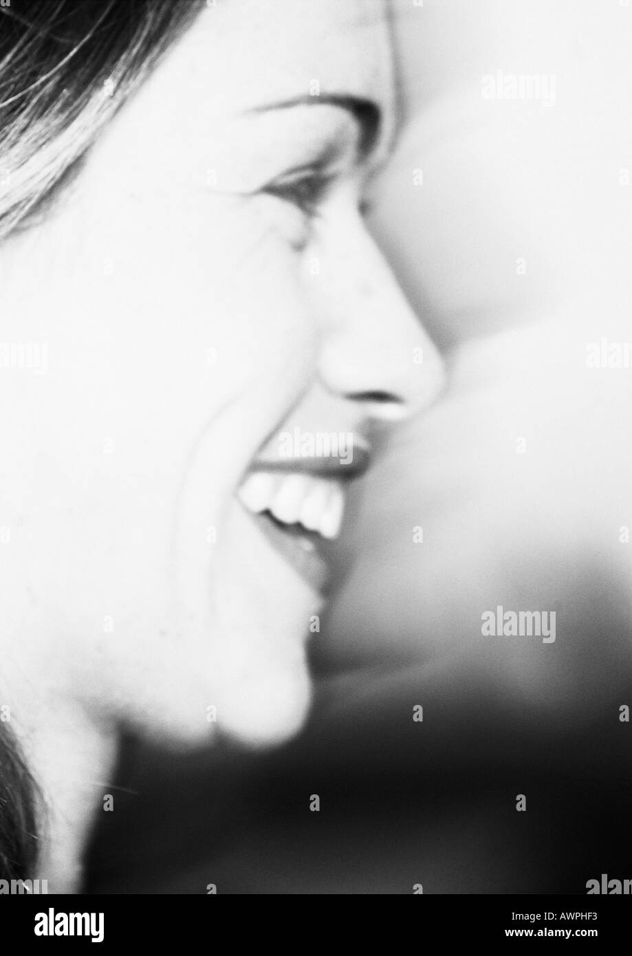 Woman smiling, side view, b&w Stock Photo - Alamy
