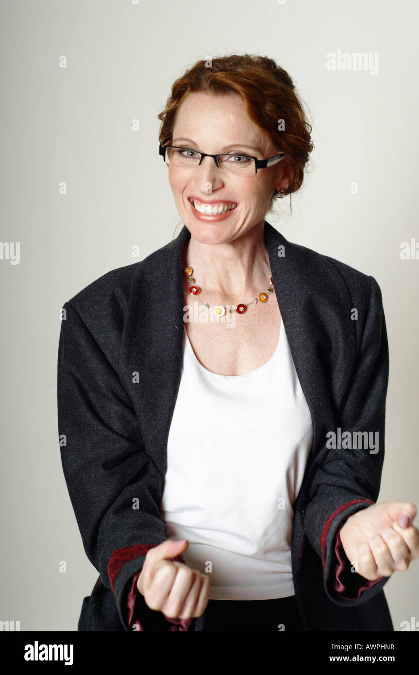 Businesswoman wearing eyeglasses happy about her success Stock Photo ...