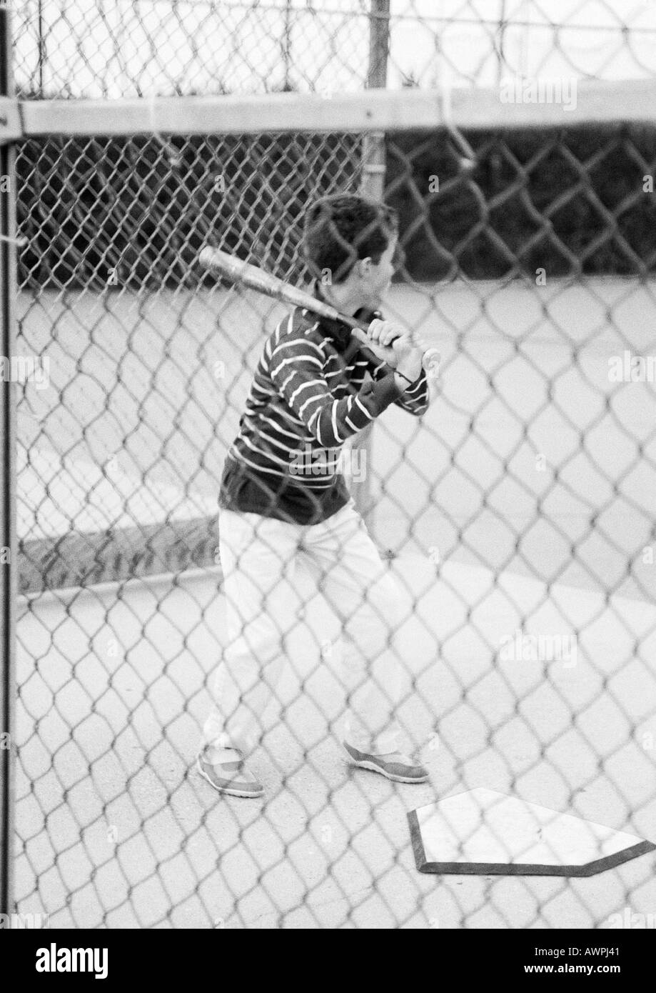 Boy holding baseball bat, rear view, b&w Stock Photo - Alamy