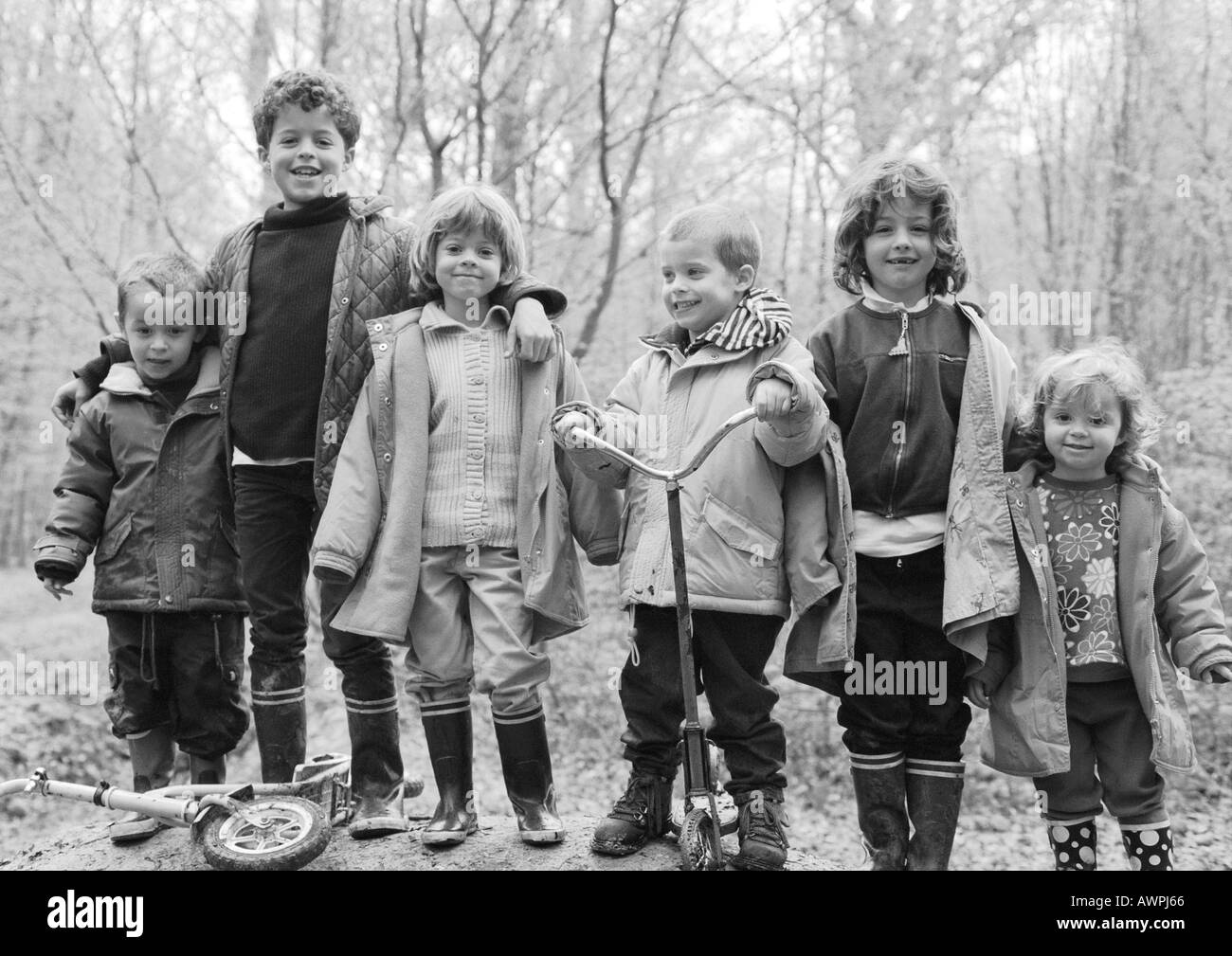 Children side by side in forest, b&w Stock Photo - Alamy
