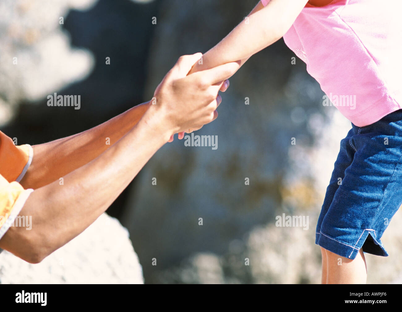Man holding daughter's hand Stock Photo - Alamy