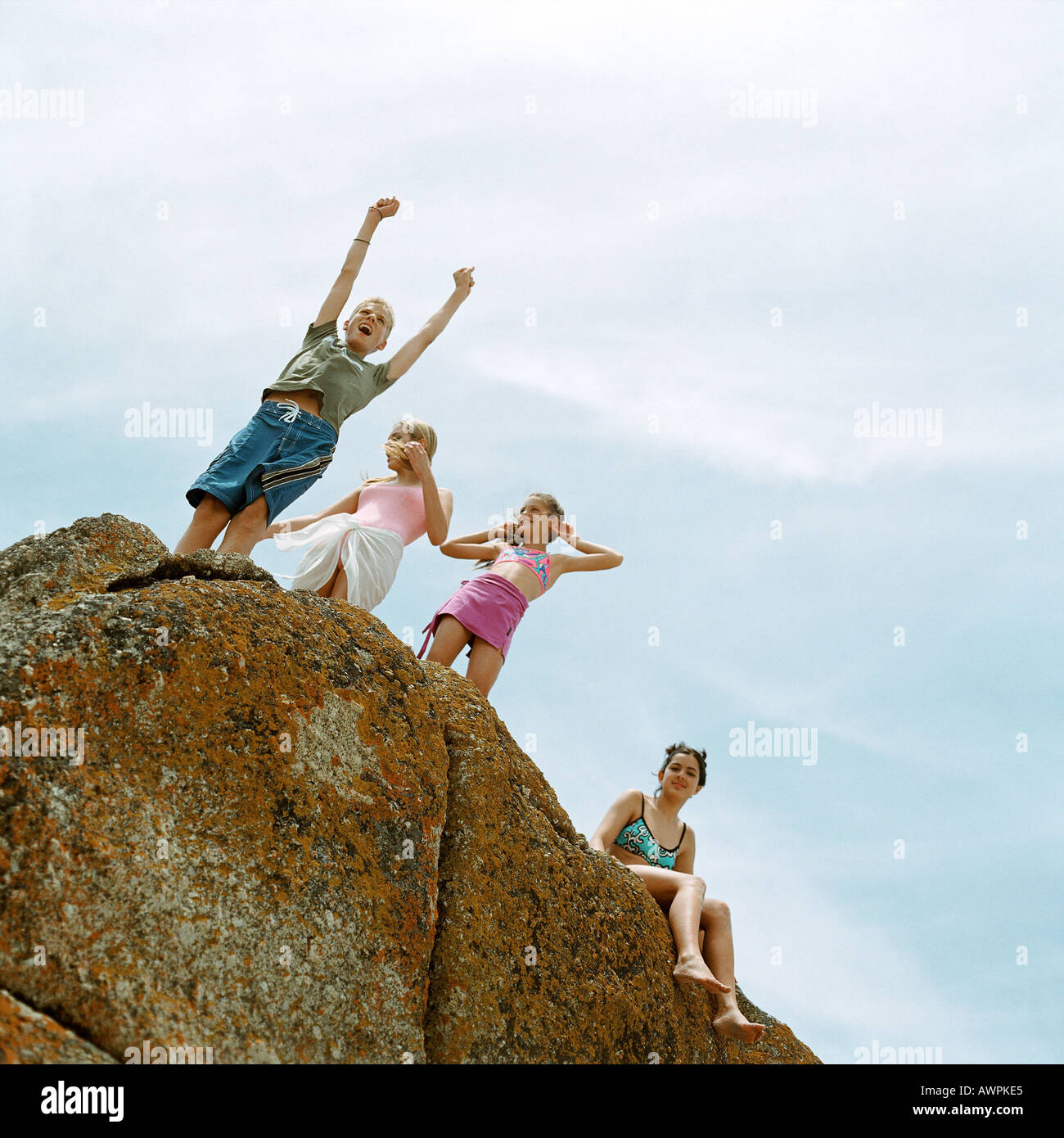People standing on rock, low angle view Stock Photo - Alamy