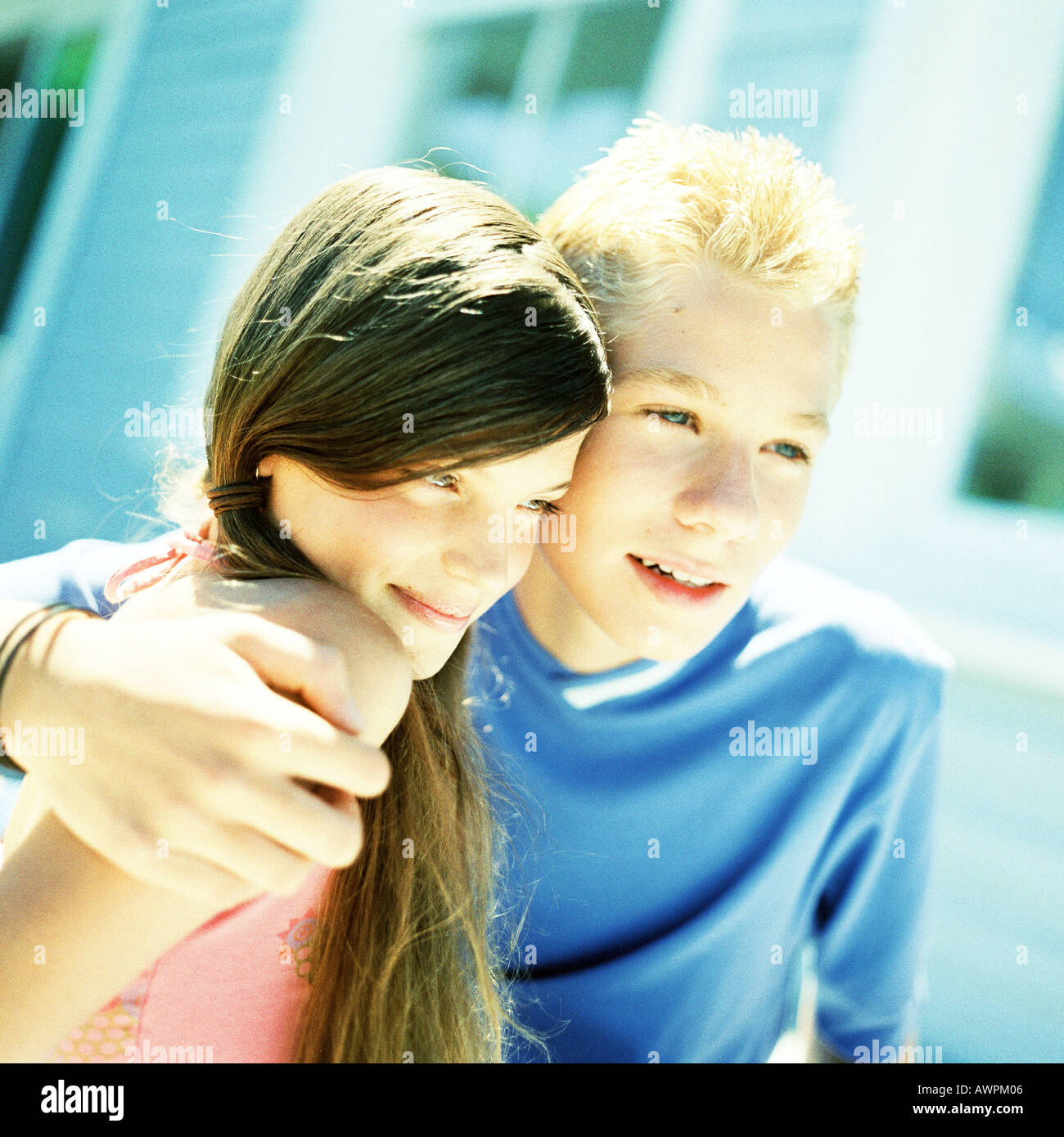 Boy with arm around girl, outside Stock Photo - Alamy