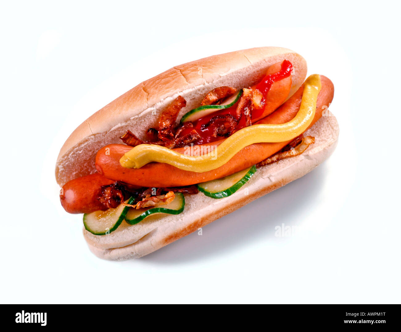 Two wieners, mustard, onions and pickles on a baguette Stock Photo - Alamy