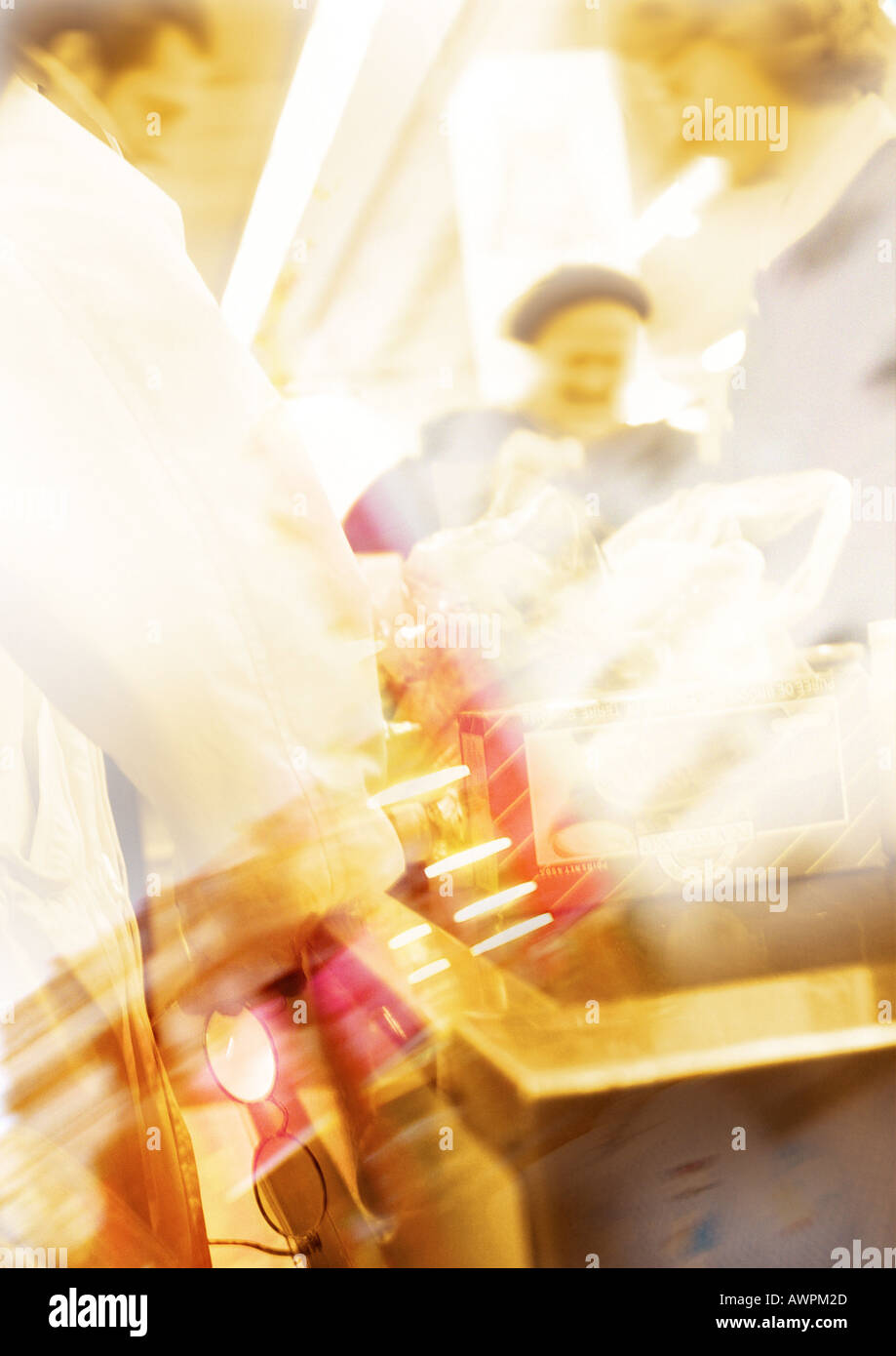 People checking out at cash register, blurred Stock Photo - Alamy