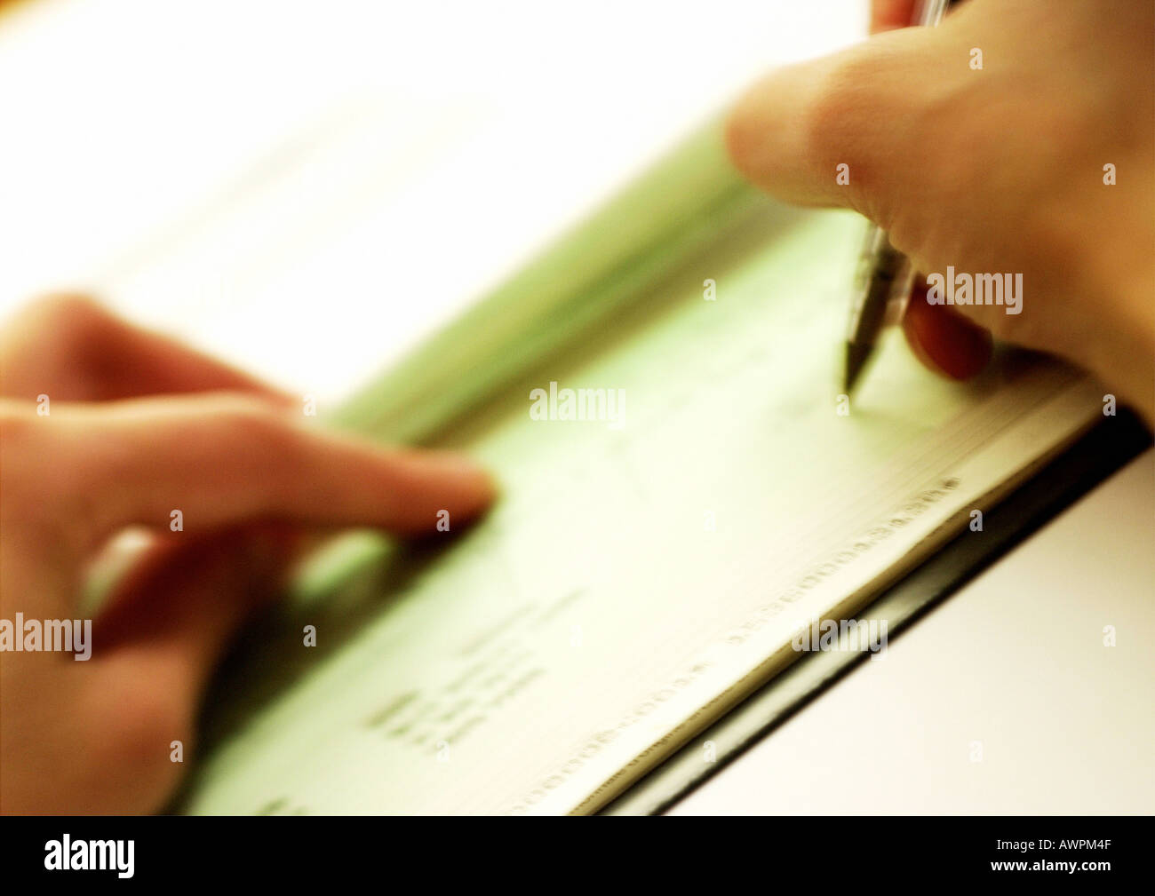 Signing cheques hi-res stock photography and images - Alamy
