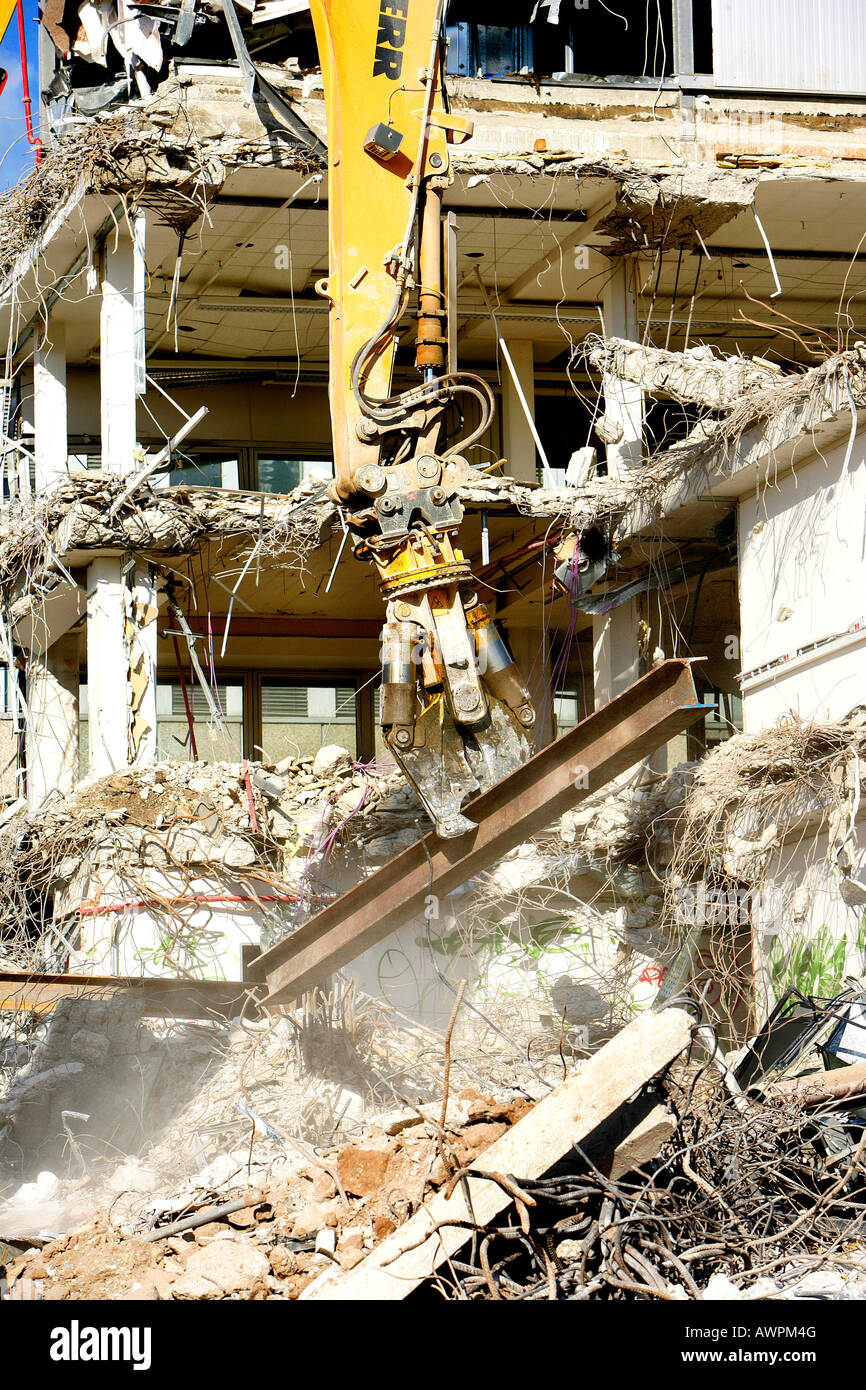 Wrecking excavator at a demolition site Stock Photo - Alamy