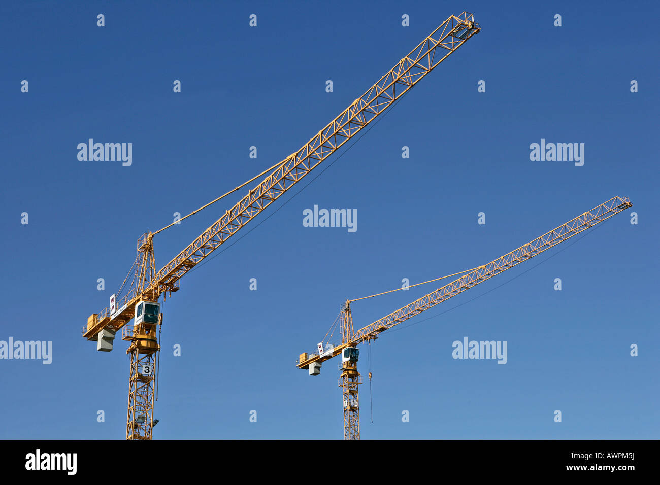 Two construction cranes Stock Photo - Alamy
