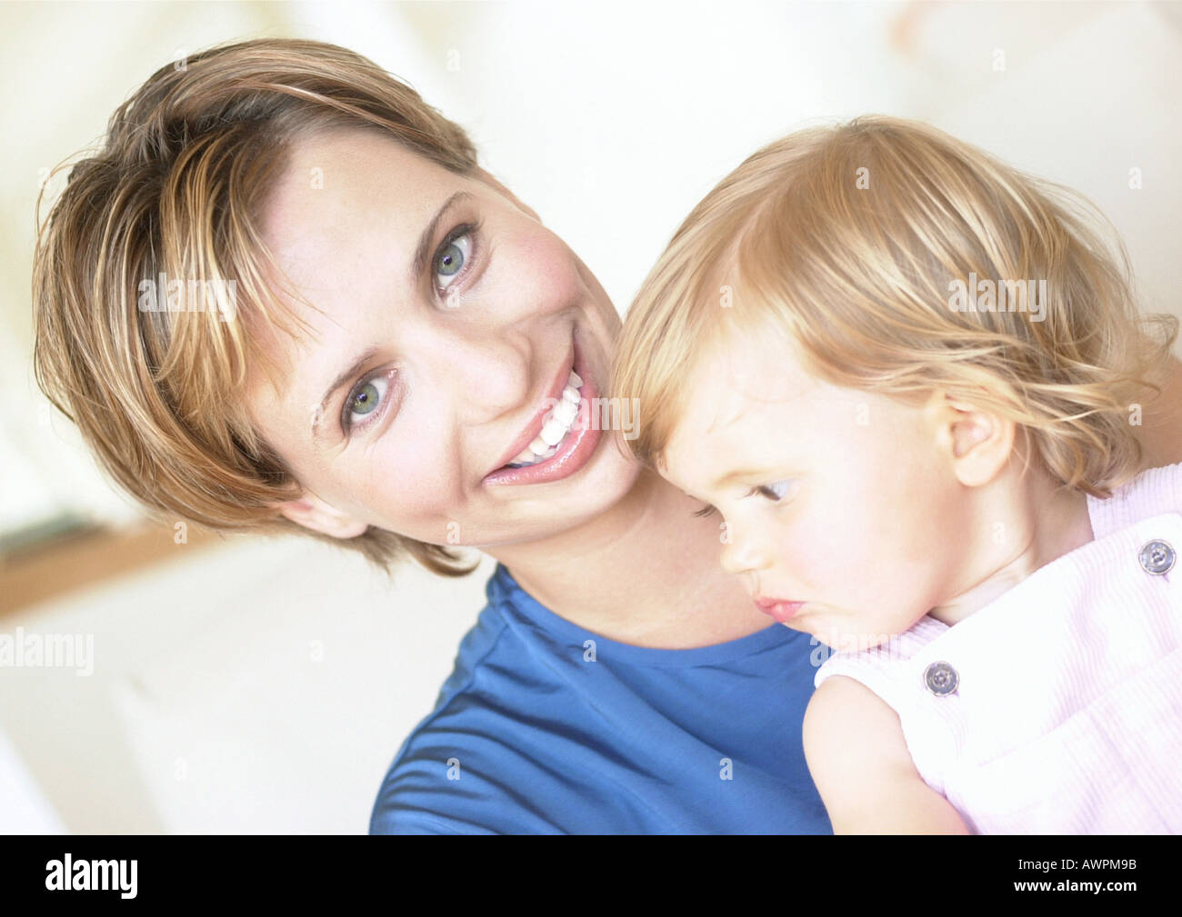 Mother holding smiling baby girl hi-res stock photography and images ...