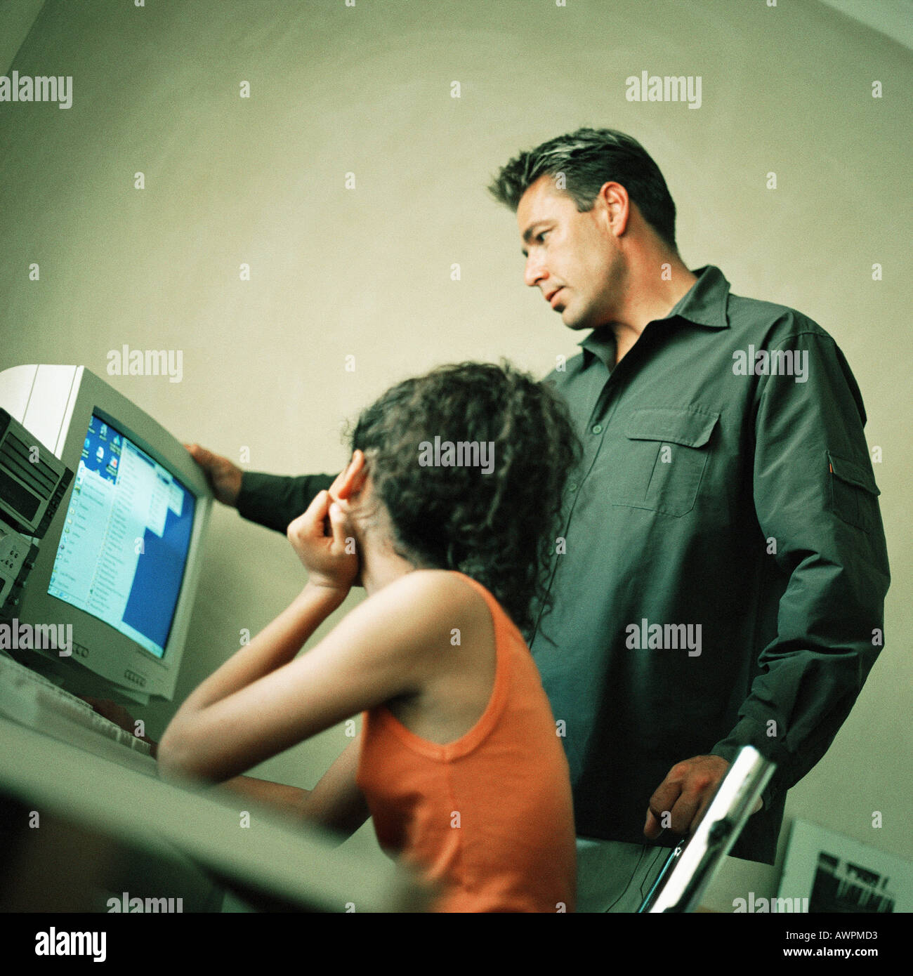 Man and girl using computer Stock Photo - Alamy