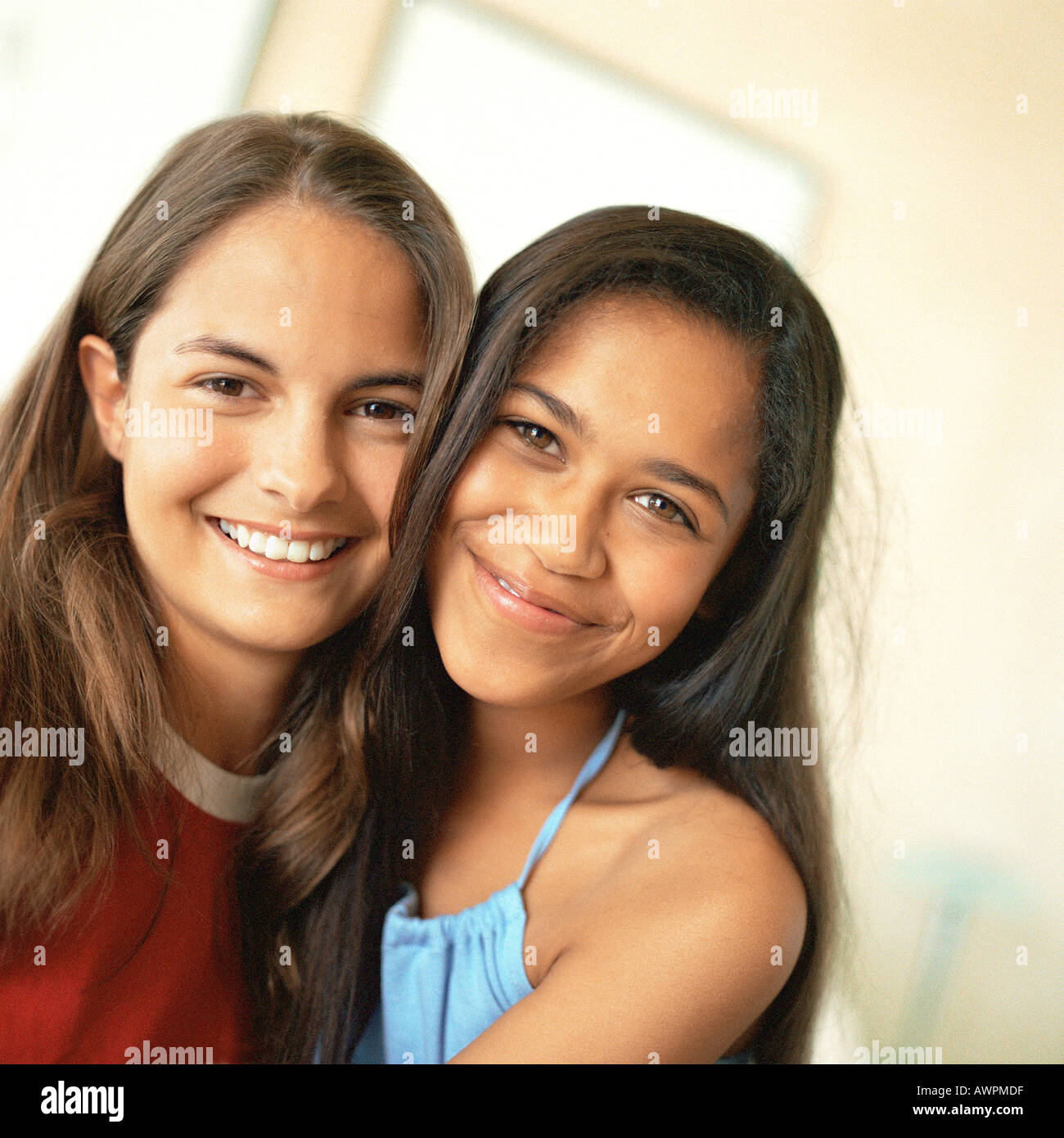 Two girls smiling, close-up, portrait Stock Photo - Alamy