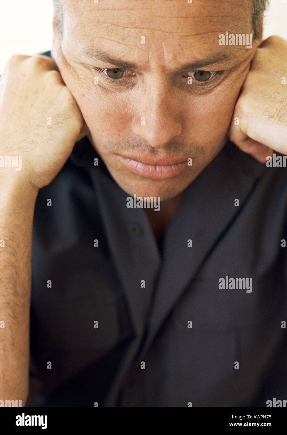 Man looking down, close-up, portrait Stock Photo - Alamy