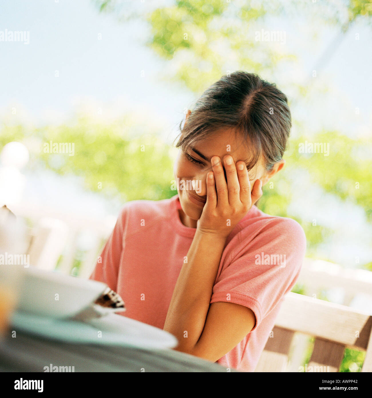 Girl with hand on face, close-up Stock Photo - Alamy