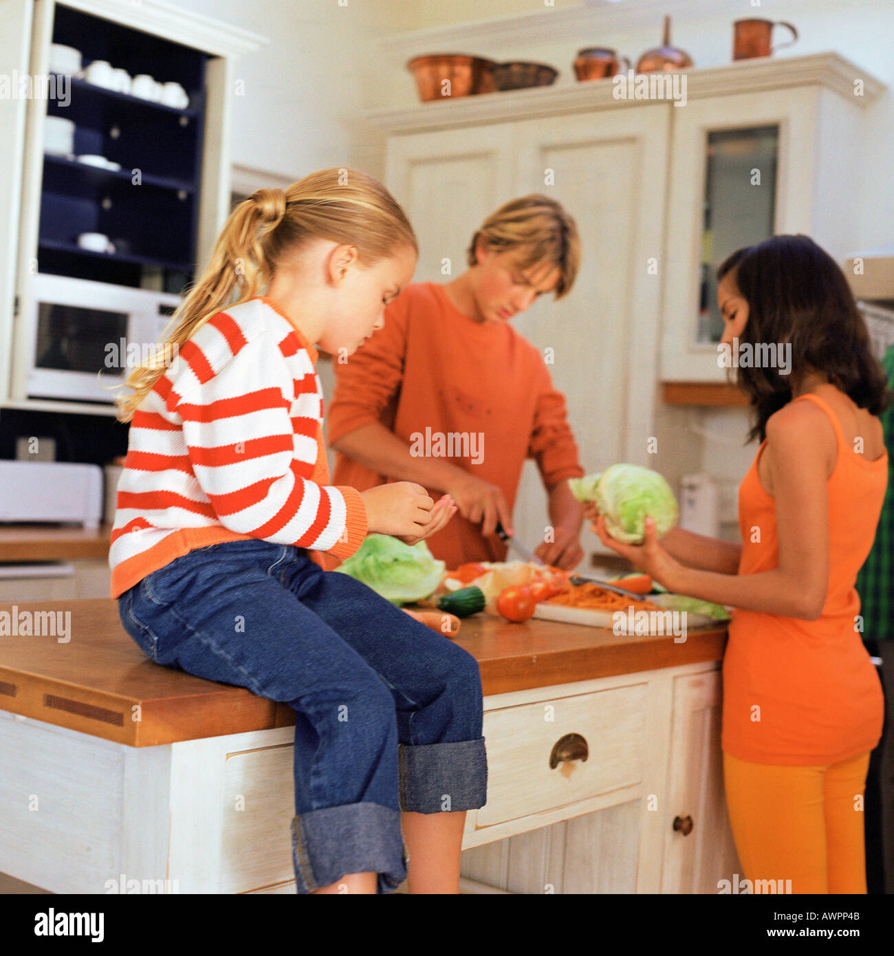 Children preparing vegetables in kitchen Stock Photo - Alamy