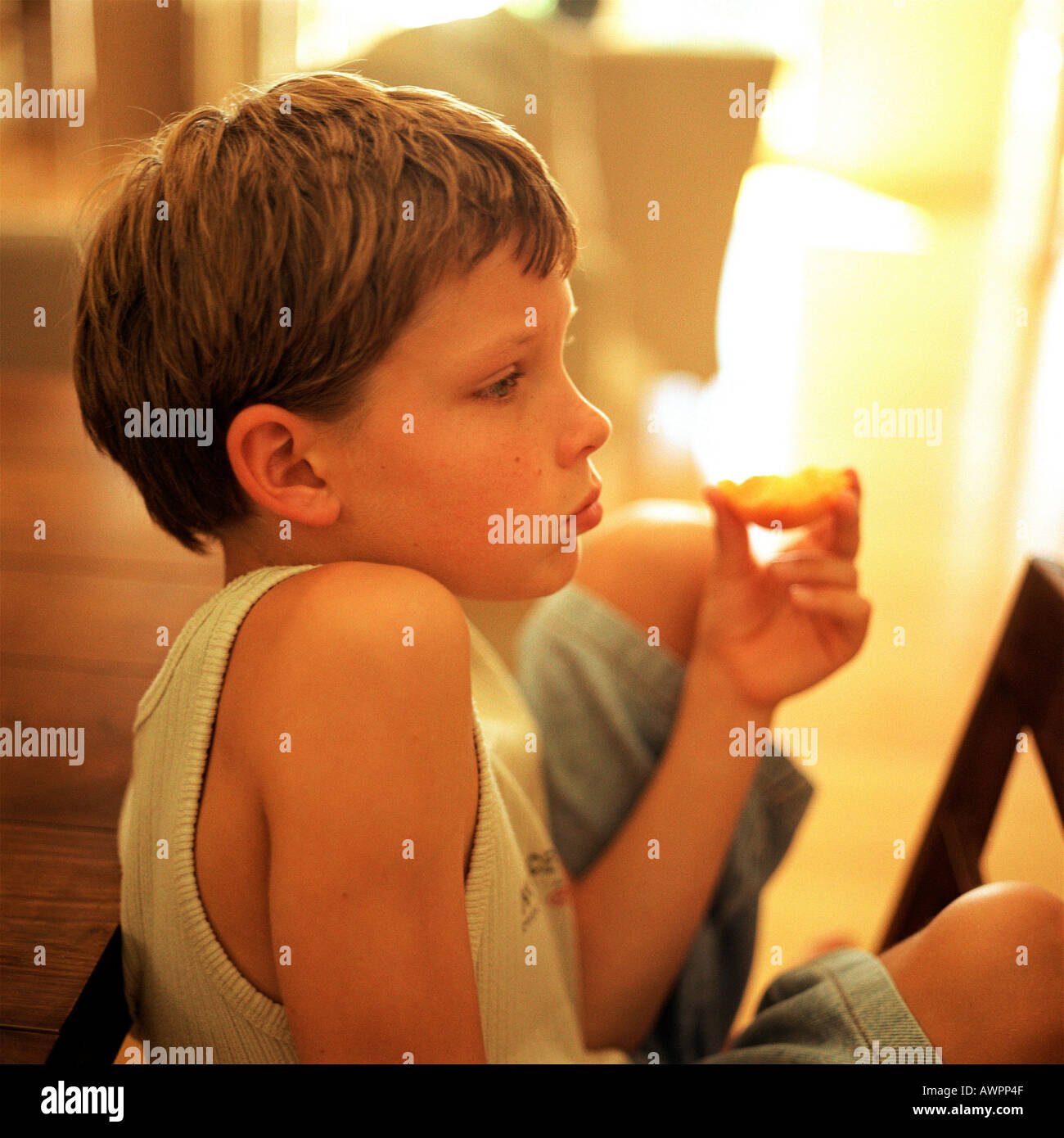 Child eating, side view Stock Photo - Alamy