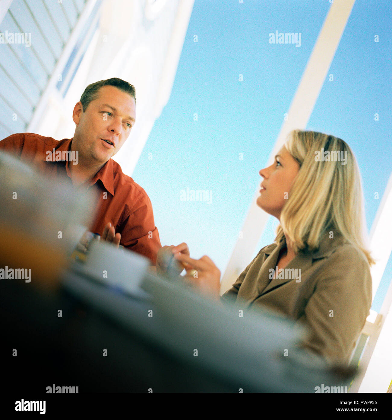 Two persons discussing table hi-res stock photography and images - Alamy