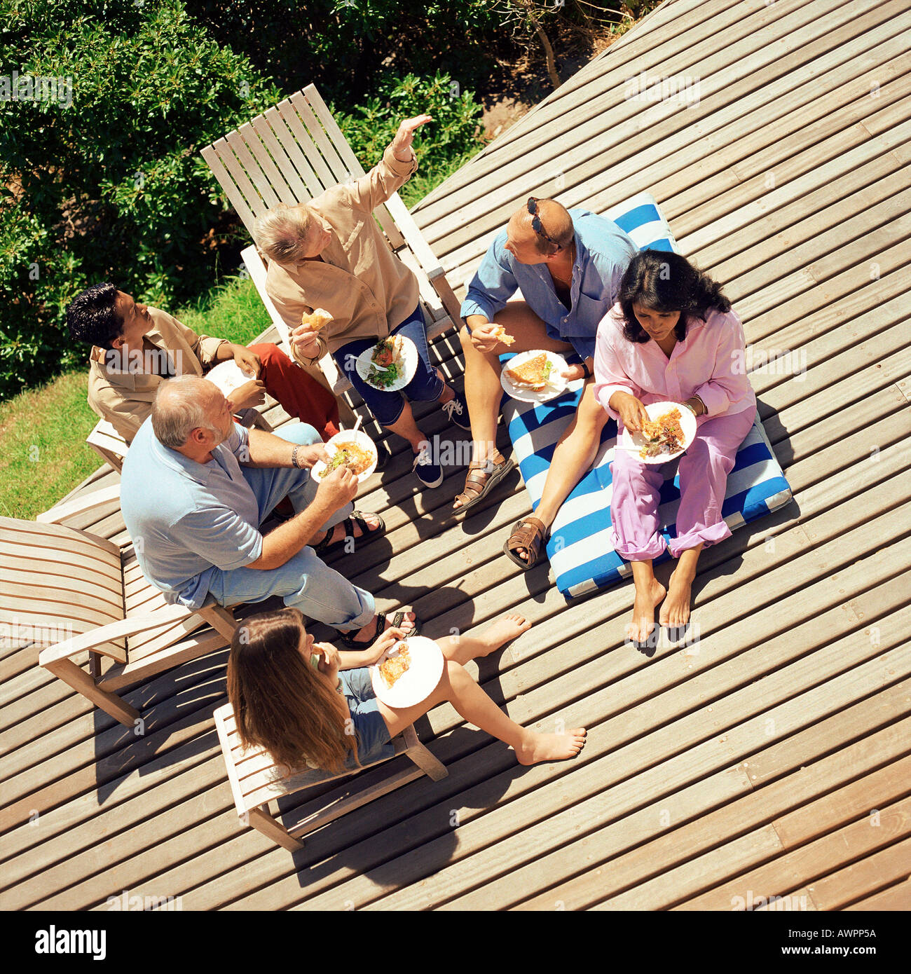 Grandparents, parents and children eating outside, elevated view Stock ...