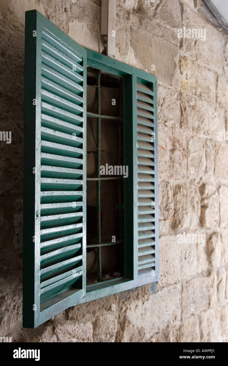 Stock photo of an open window with open shutters in a narrow old city ...