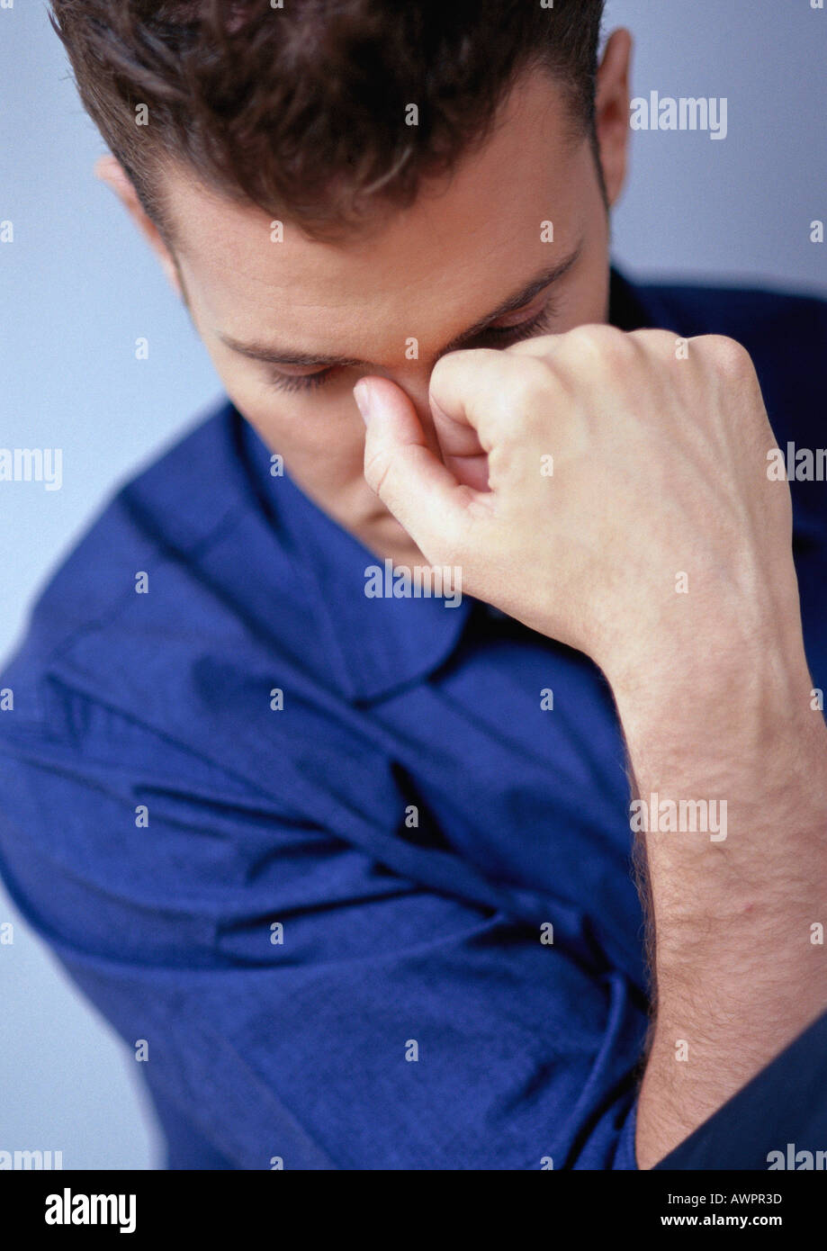 Man with hand in front of face, close-up Stock Photo - Alamy