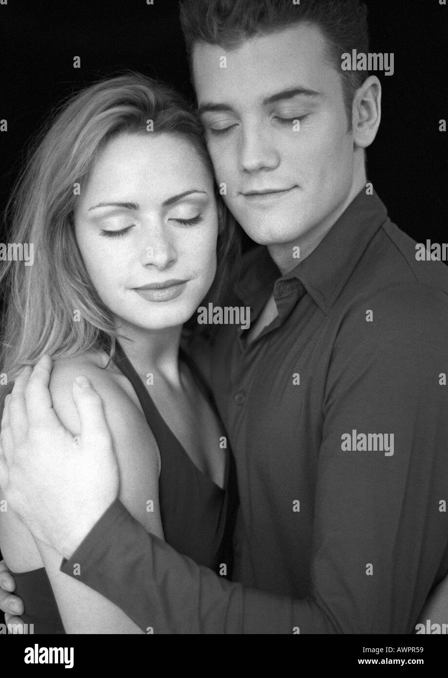 Couple hugging, eyes closed, b&w Stock Photo - Alamy