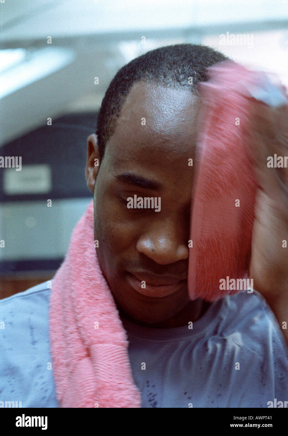 Man wiping off face with towel, close-up Stock Photo - Alamy