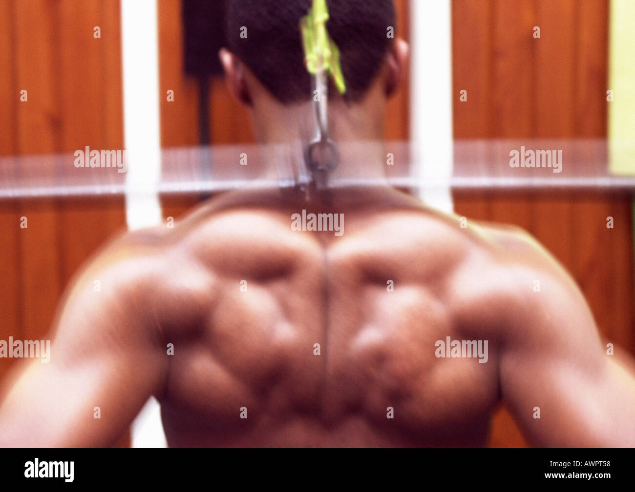 Man using weight machine, rear view Stock Photo - Alamy