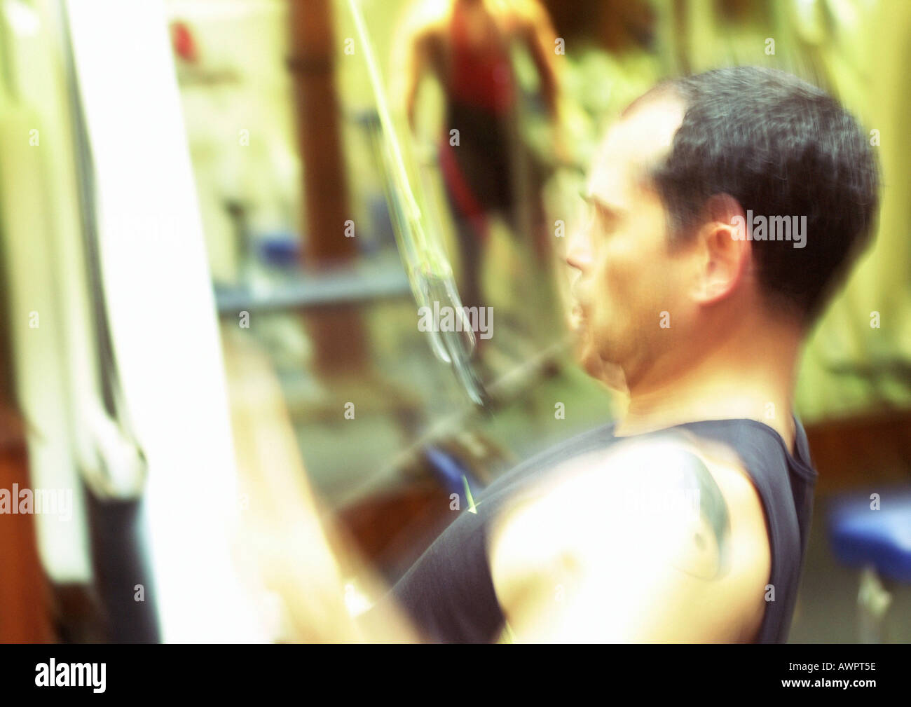 Man using weight machines in hi-res stock photography and images - Alamy