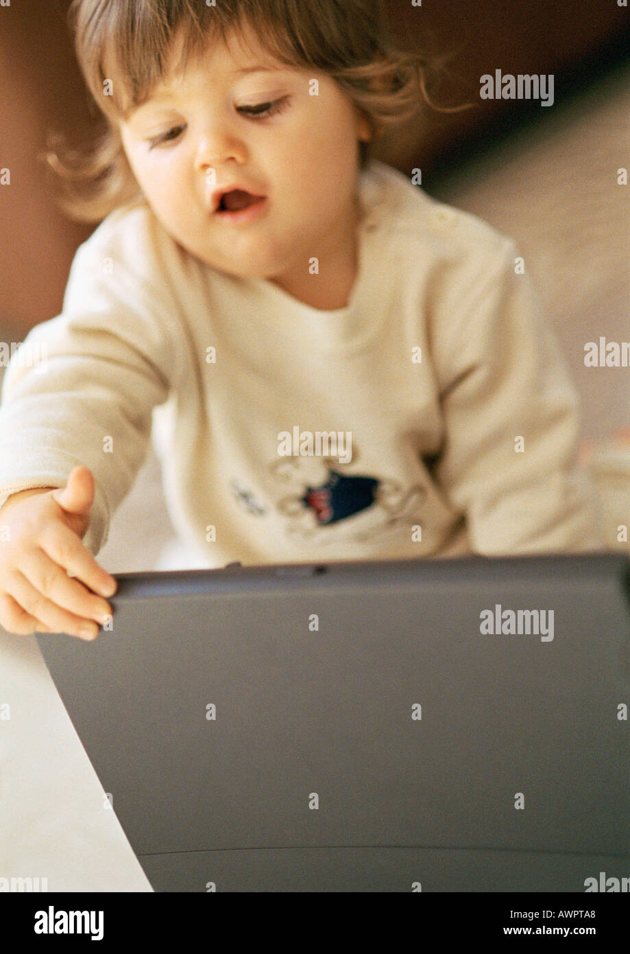 Baby with laptop, portrait Stock Photo - Alamy