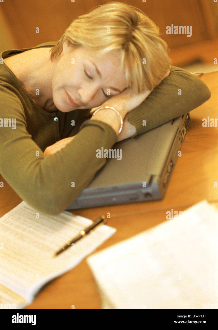 Woman sleeping on laptop Stock Photo - Alamy