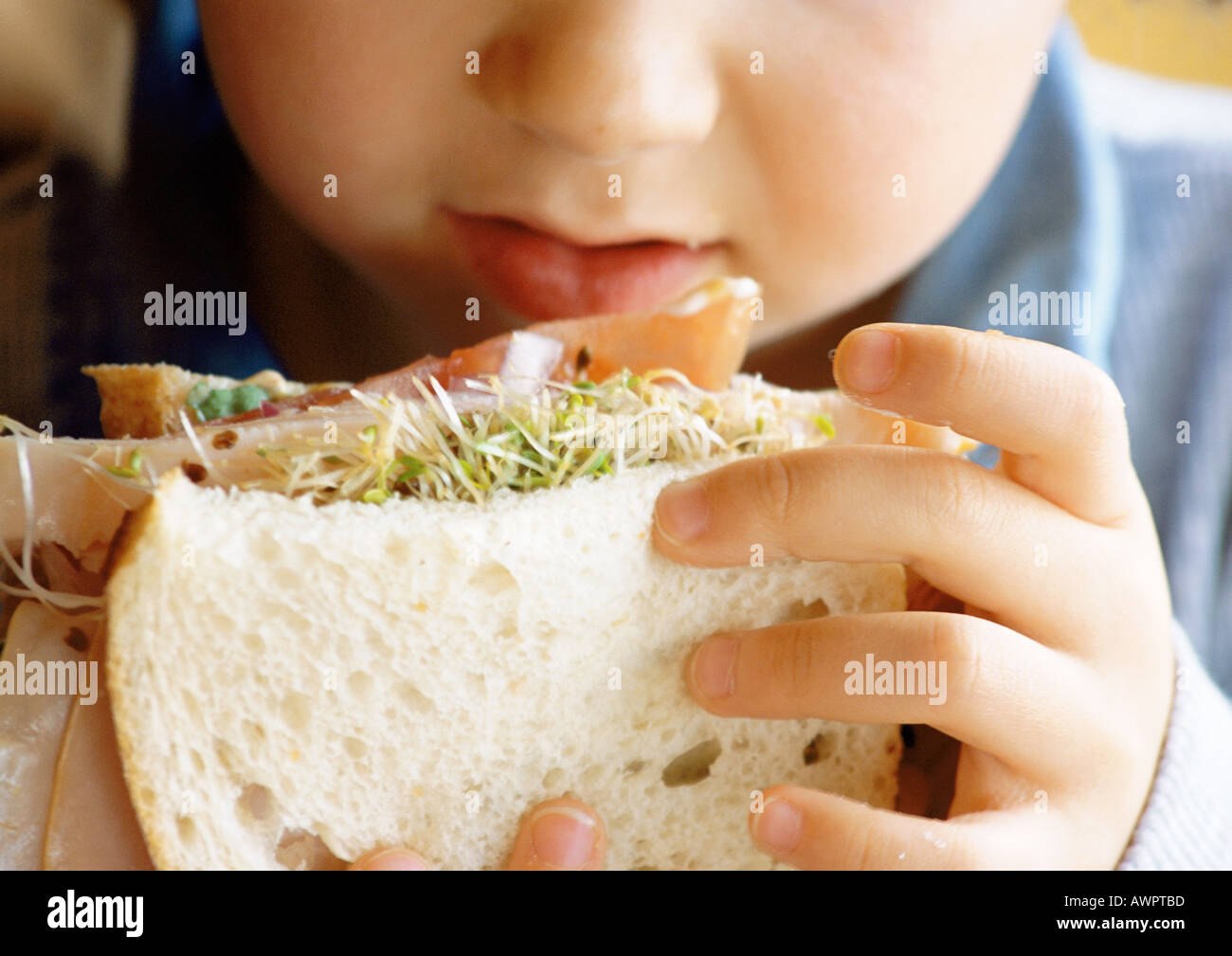 Boy eating large sandwich hi-res stock photography and images - Alamy
