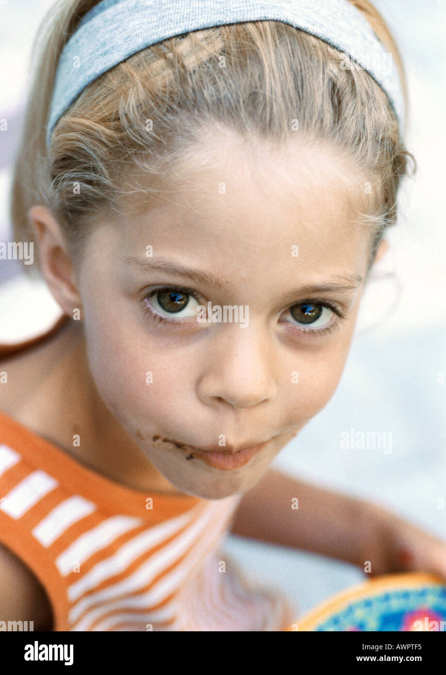 Little girl with chocolate on face, looking into camera, portrait Stock ...