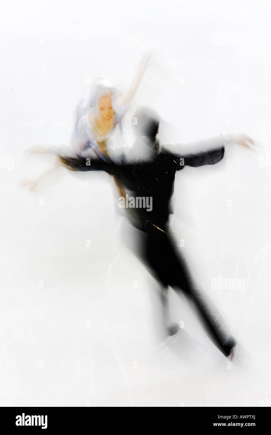Blurred action of pairs figure skaters Stock Photo - Alamy