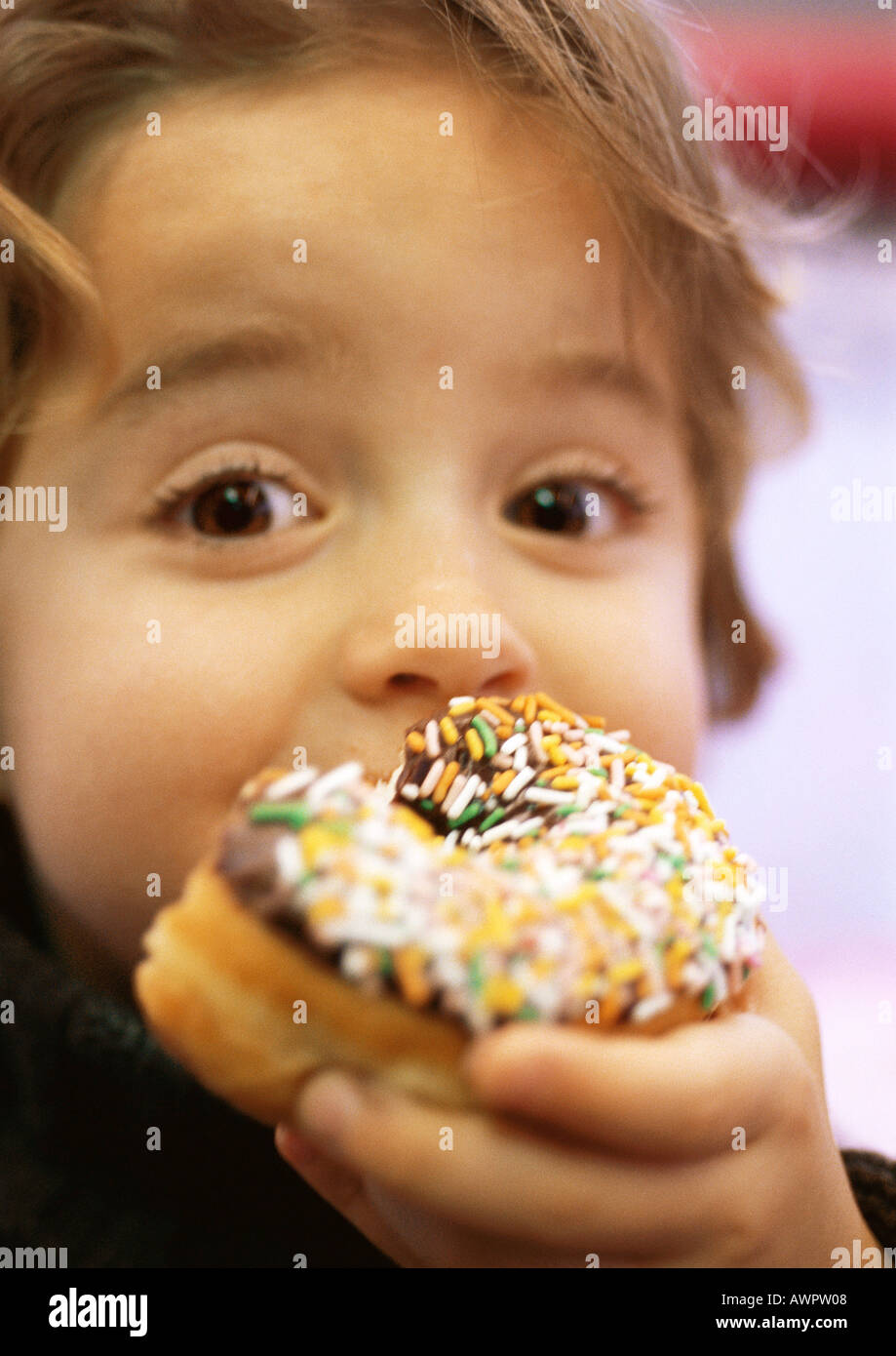 Child eats doughnut hi-res stock photography and images - Alamy