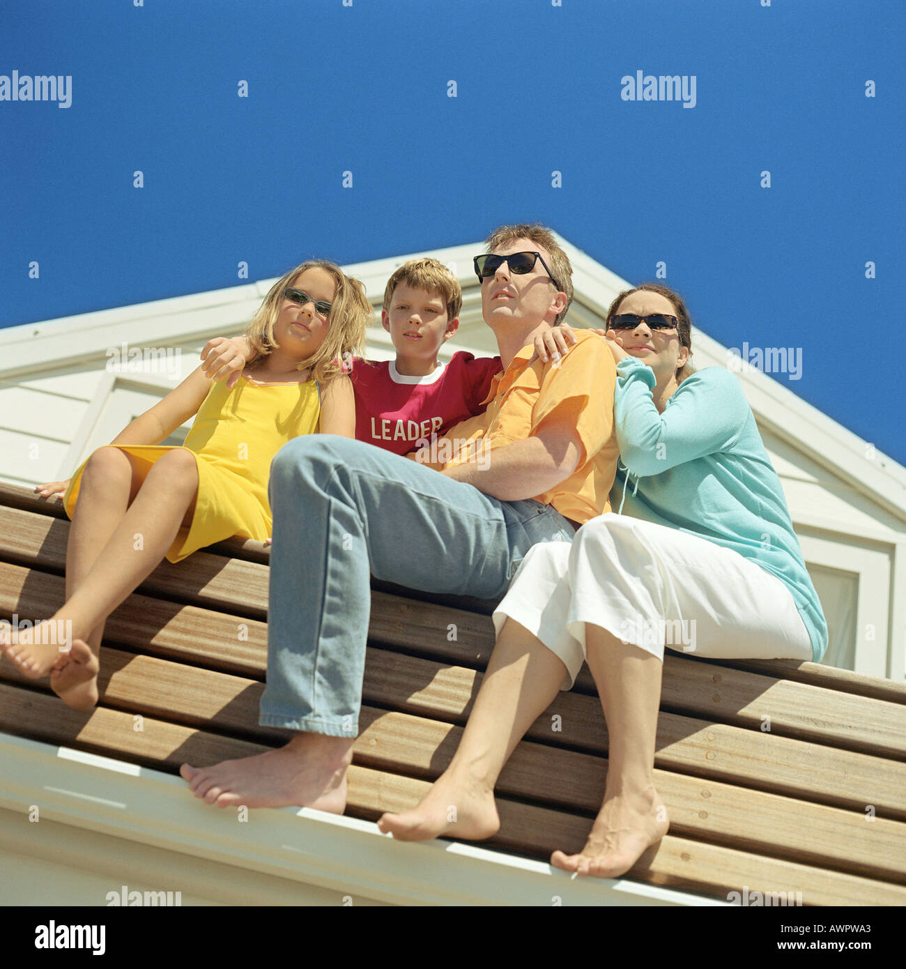 Family portrait, low angle view Stock Photo - Alamy
