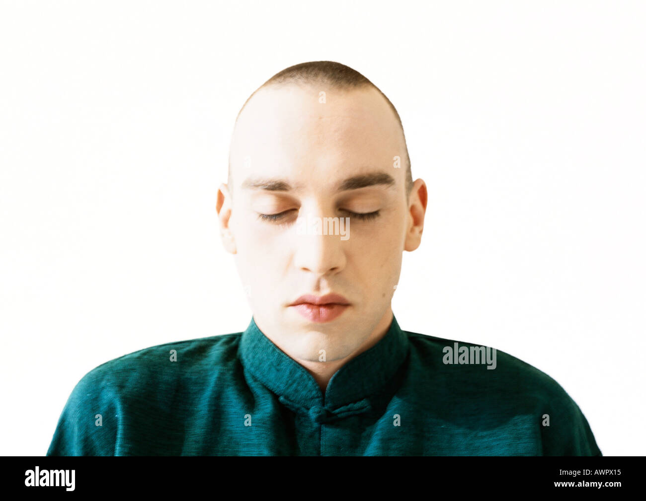 Man meditating, head and shoulders Stock Photo - Alamy