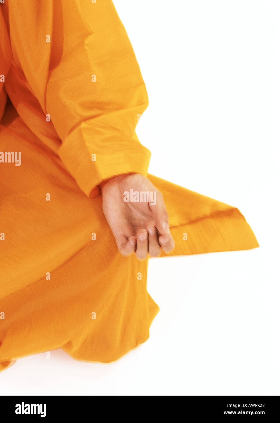 Buddhist monk's hand on knee in lotus position Stock Photo - Alamy